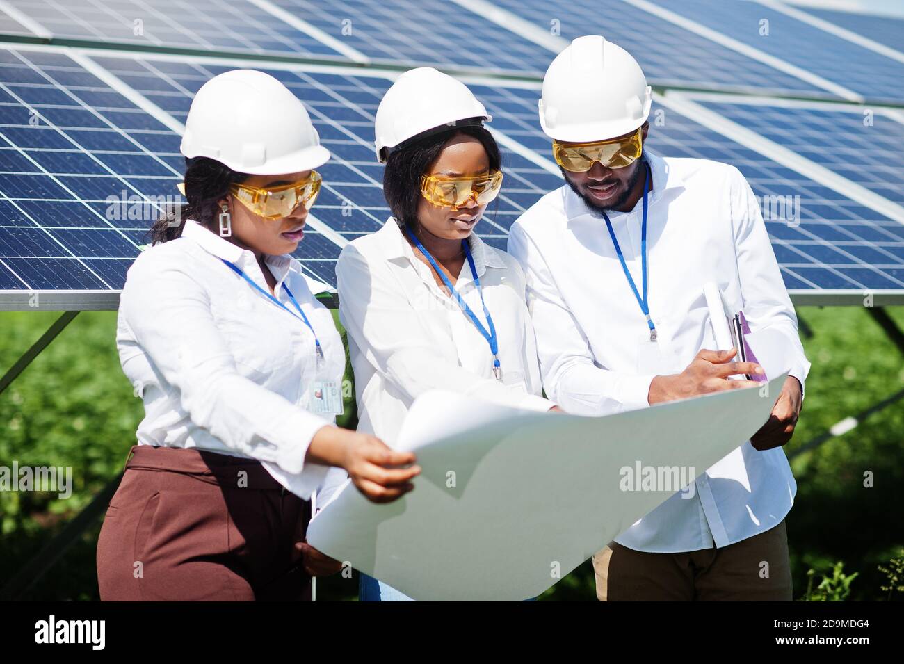 African american technician checks the maintenance of the solar panels ...