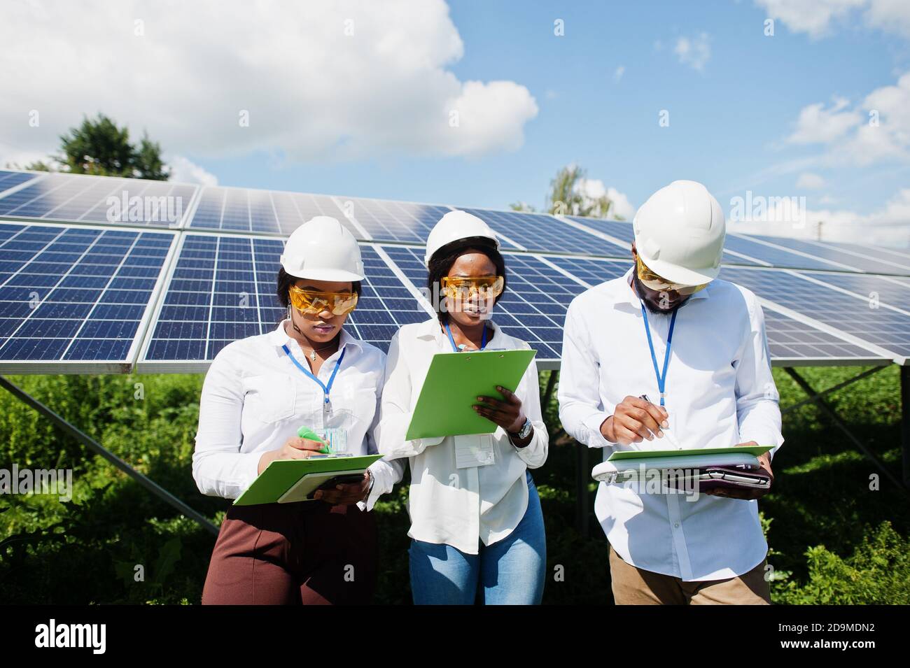 African american technician checks the maintenance of the solar panels ...