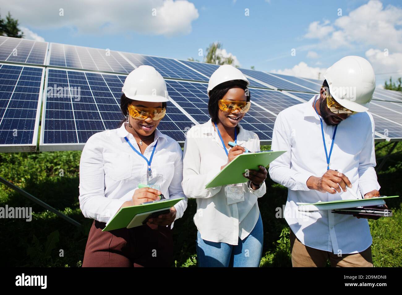 African american technician checks the maintenance of the solar panels ...