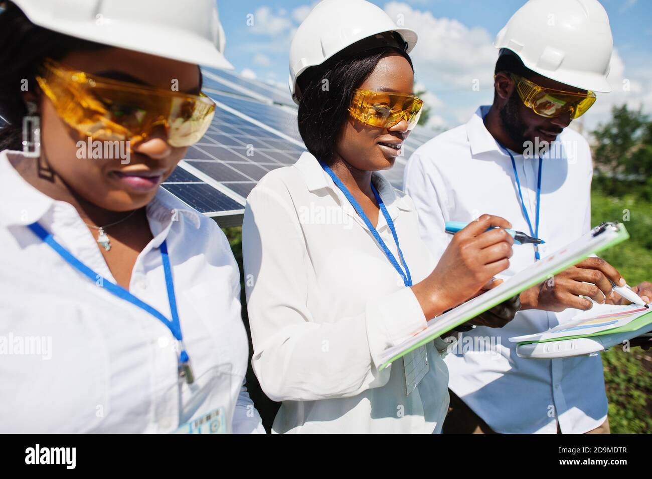 African american technician checks the maintenance of the solar panels ...