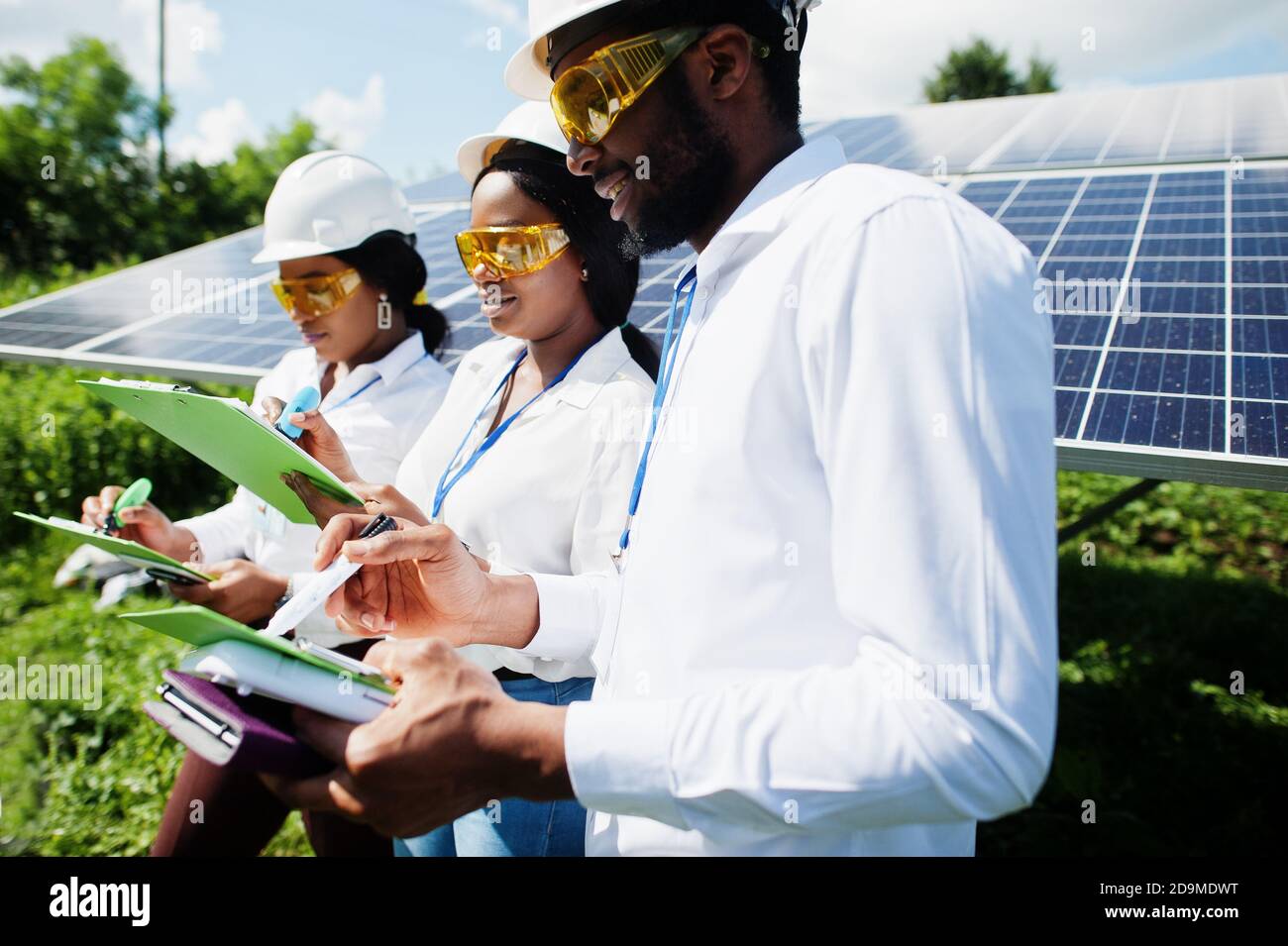 African american technician checks the maintenance of the solar panels ...