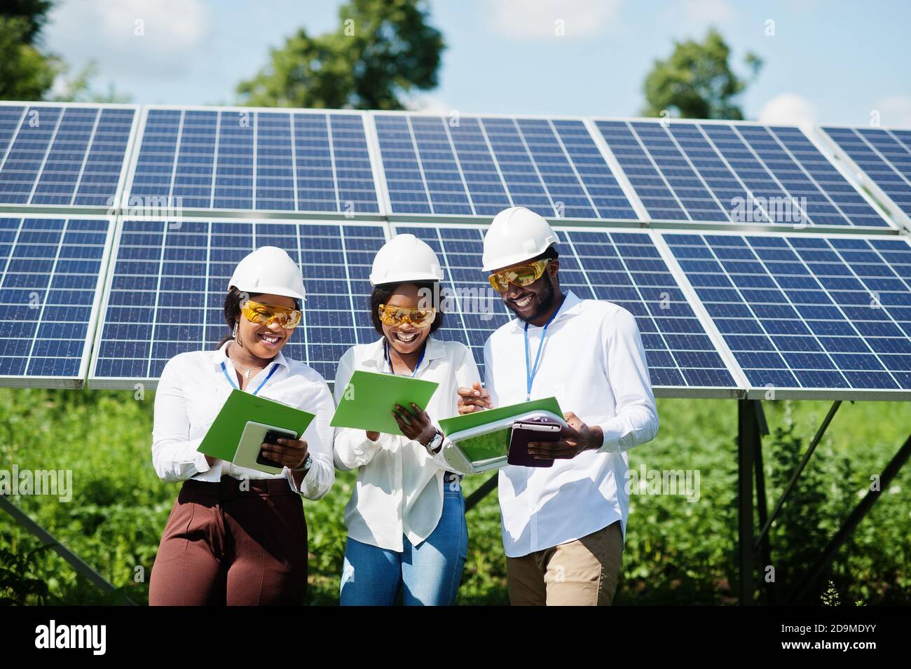 African american technician checks the maintenance of the solar panels ...