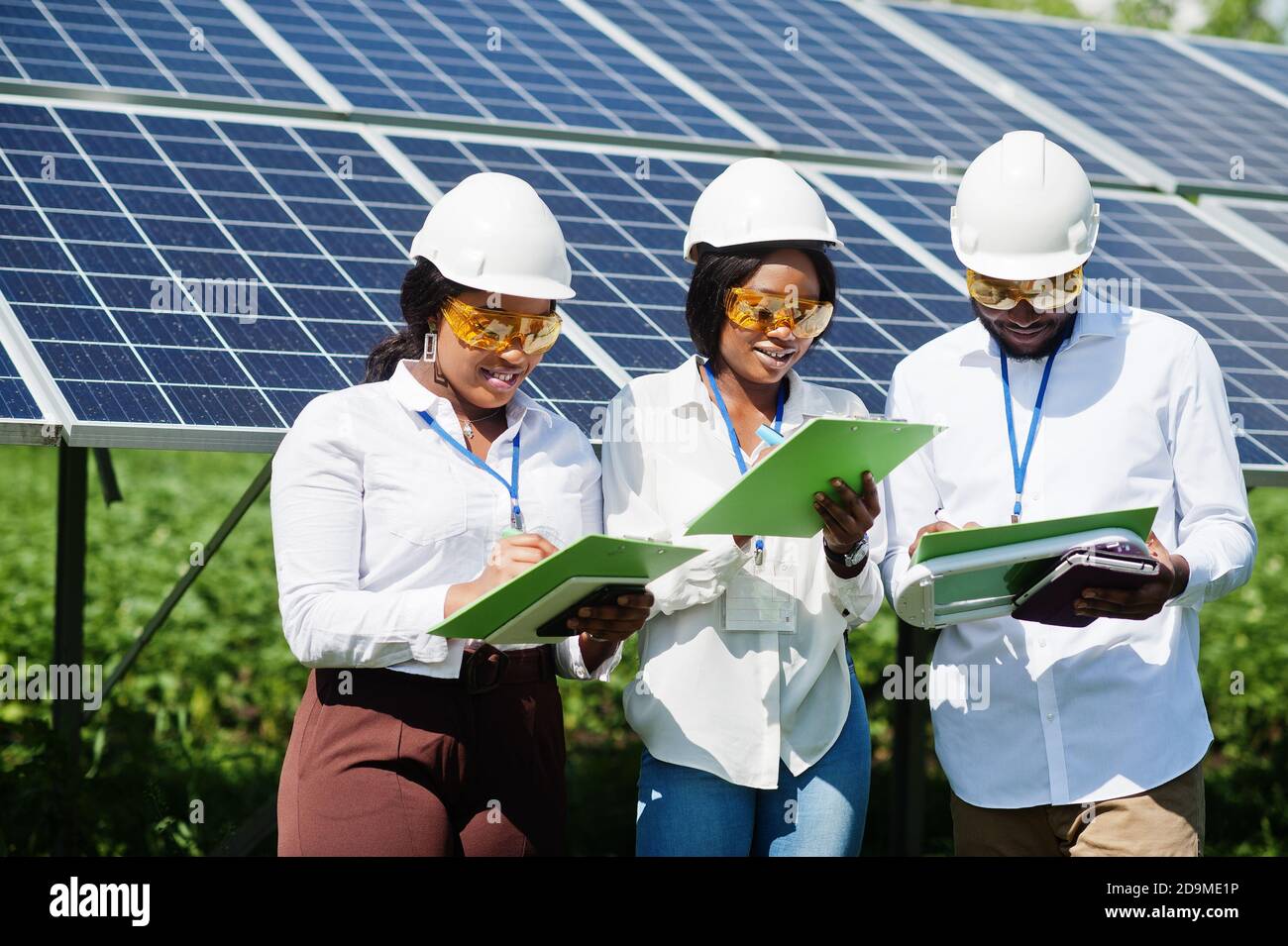 African american technician checks the maintenance of the solar panels ...