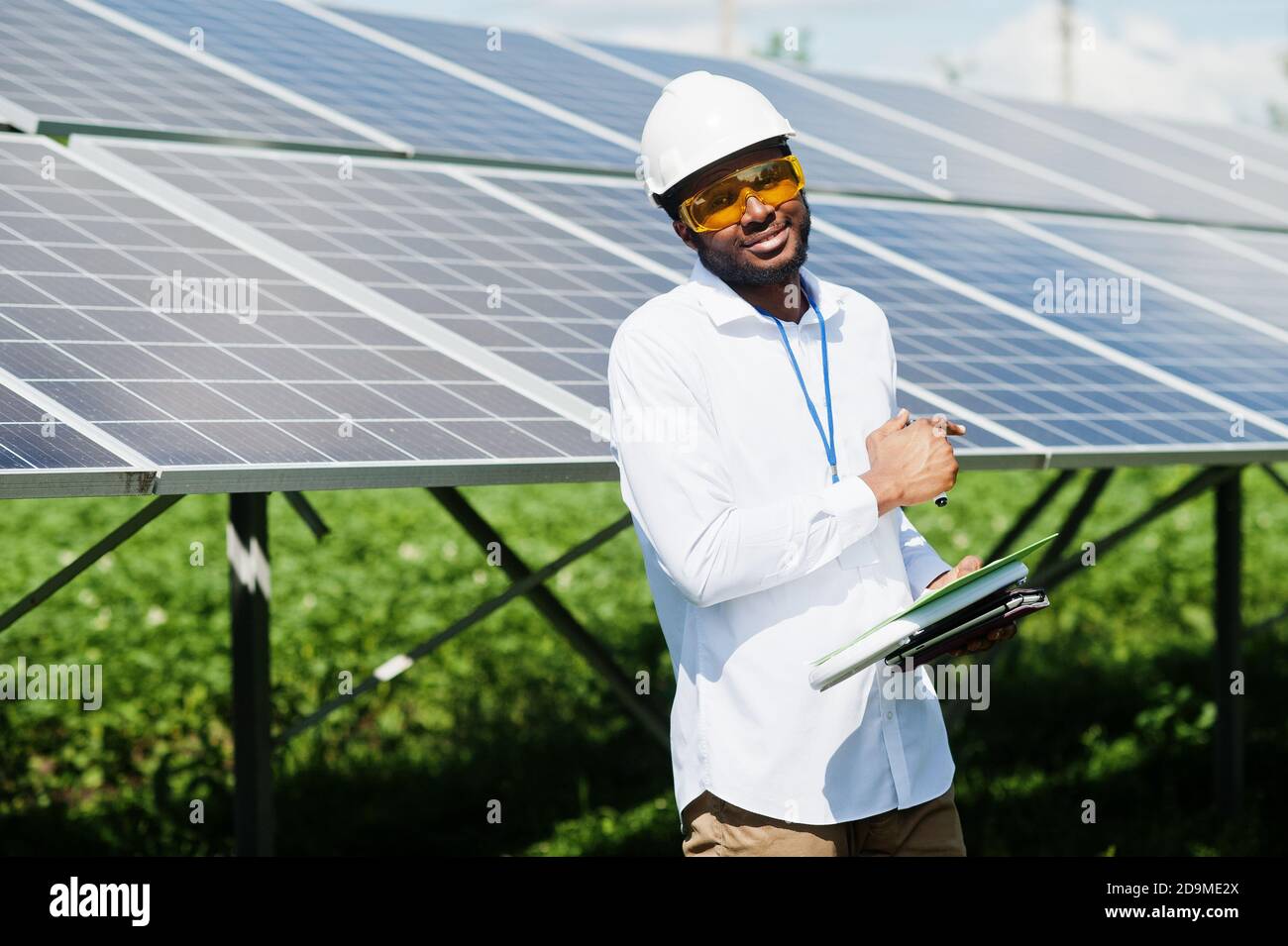 African american technician check the maintenance of the solar panels ...