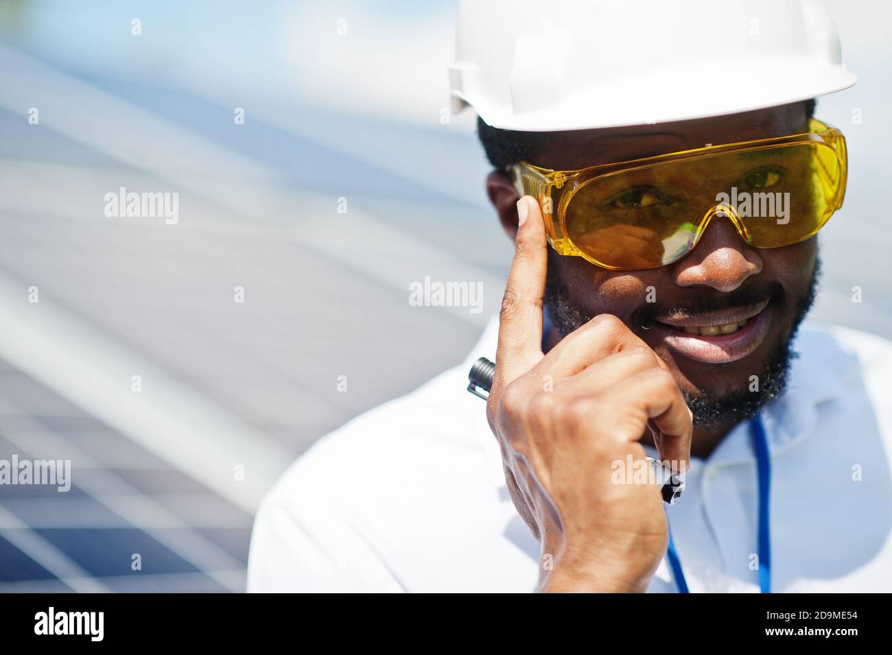 African american technician check the maintenance of the solar panels ...