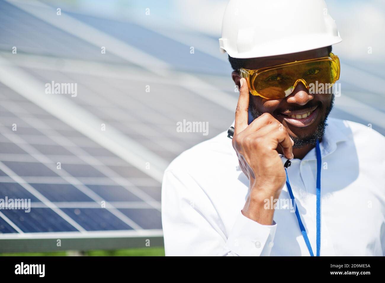 African american technician check the maintenance of the solar panels ...