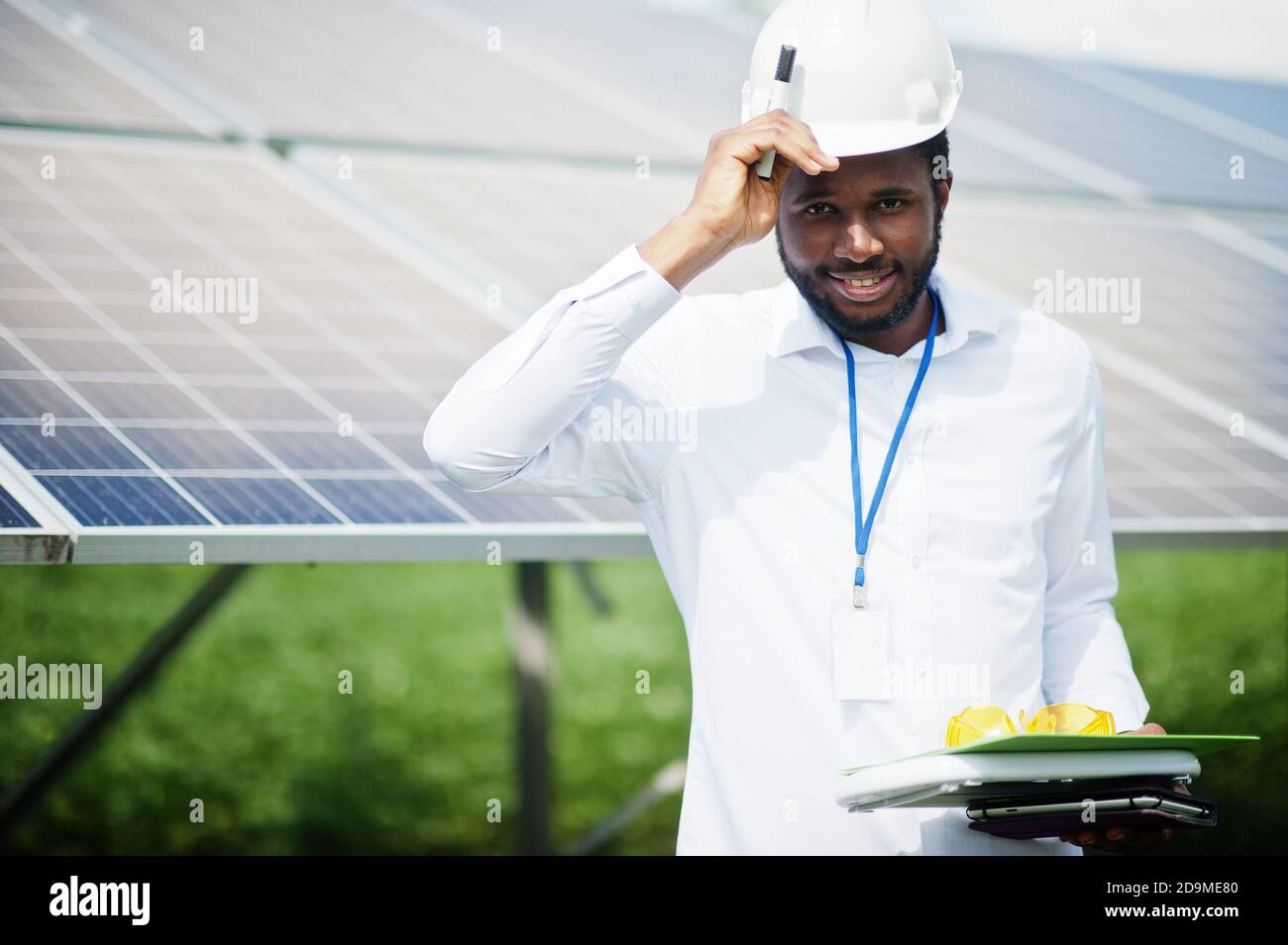 African american technician check the maintenance of the solar panels ...