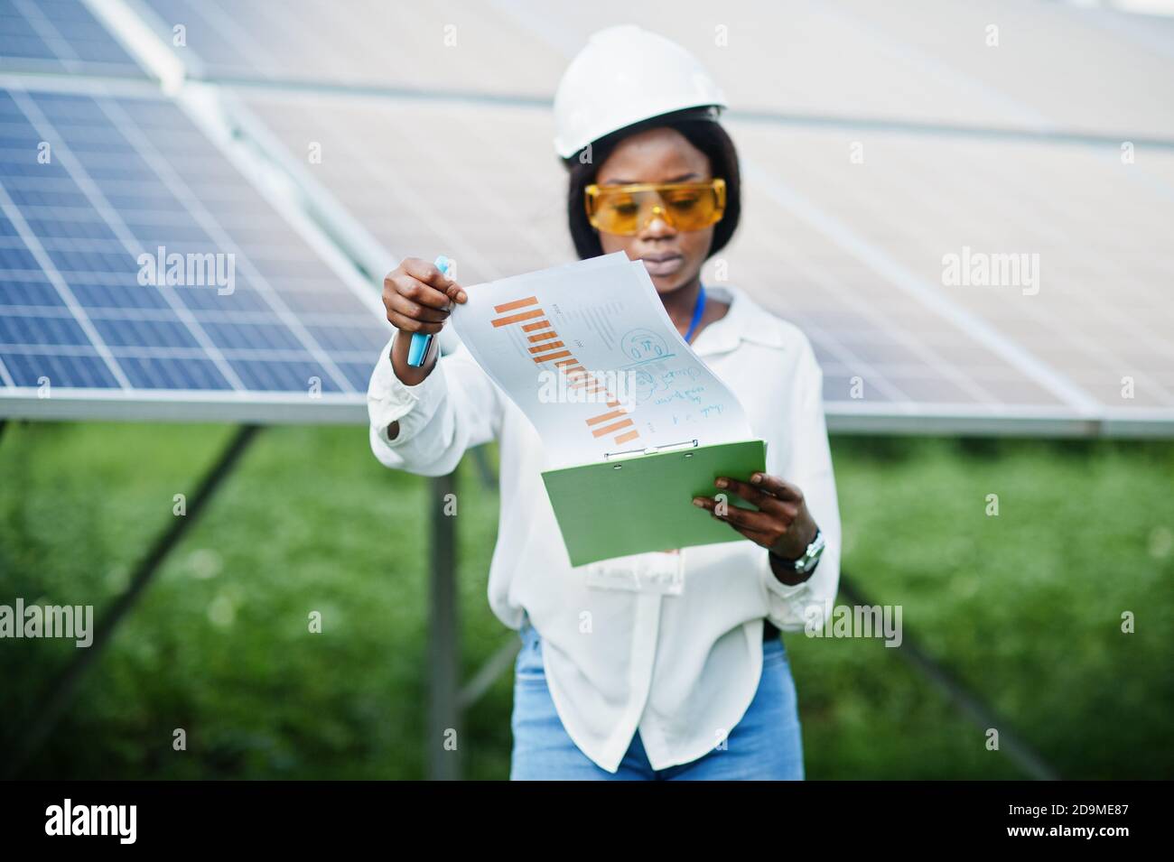 African american technician check the maintenance of the solar panels ...