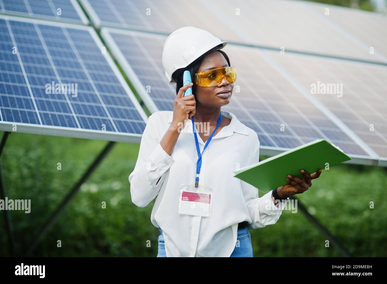 African american technician check the maintenance of the solar panels ...