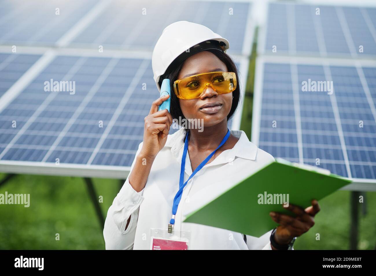 African american technician check the maintenance of the solar panels ...