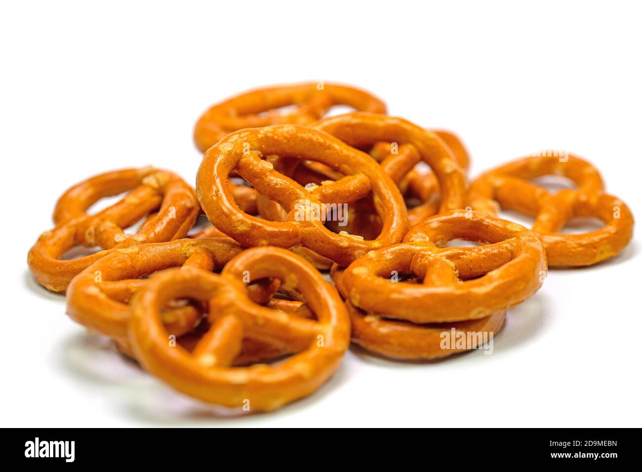Salt pretzels against a white background Stock Photo - Alamy