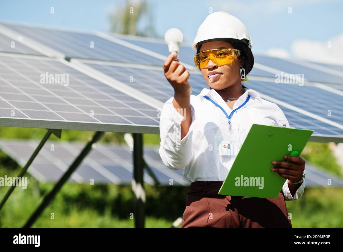 African american technician check the maintenance of the solar panels ...