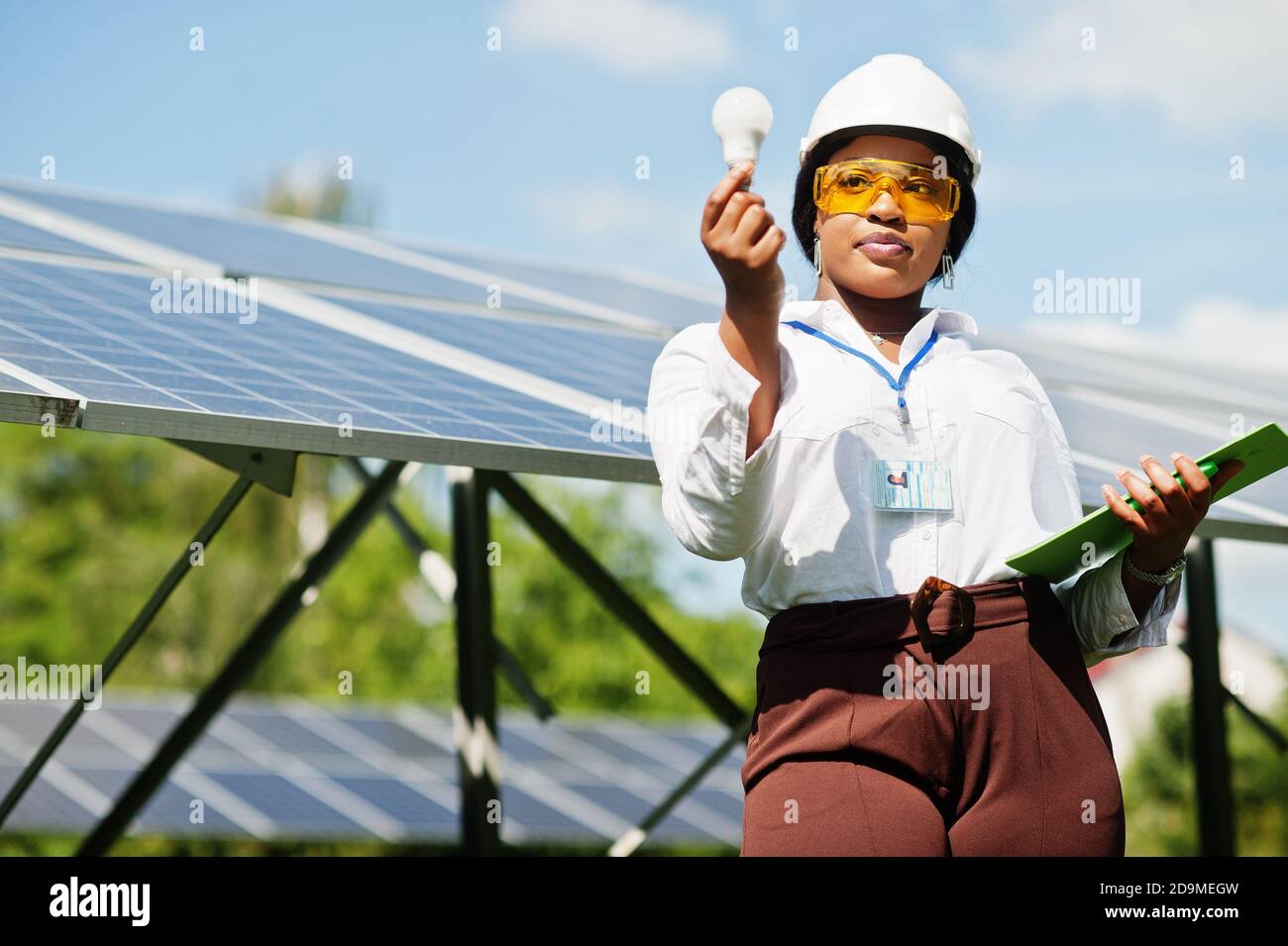 African american technician check the maintenance of the solar panels ...