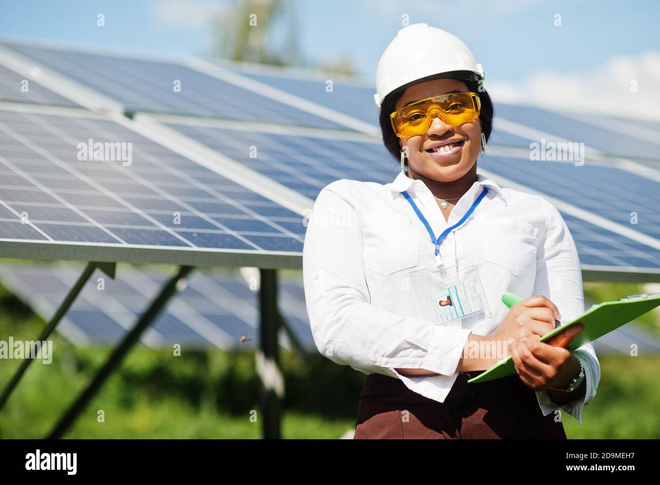 African american technician check the maintenance of the solar panels ...
