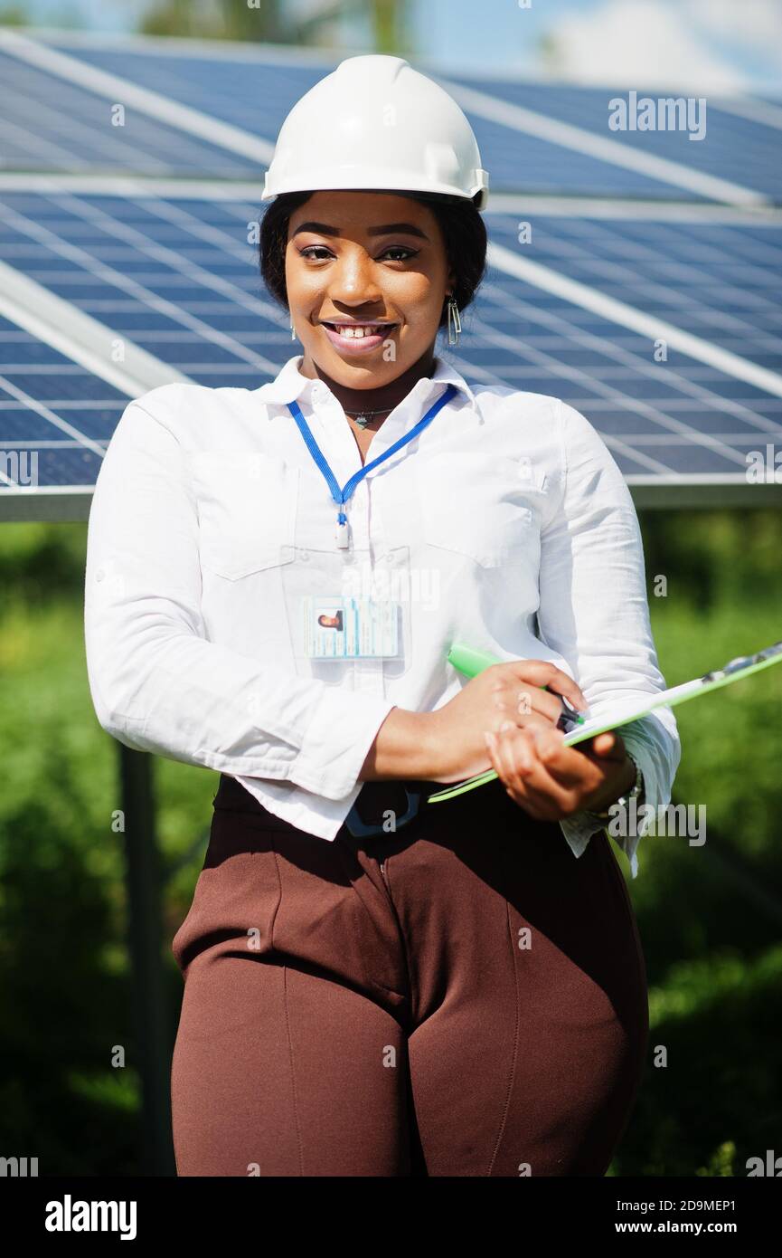 African american technician check the maintenance of the solar panels ...