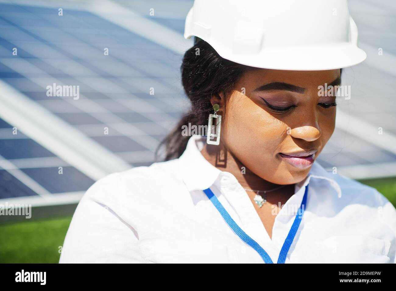 African american technician check the maintenance of the solar panels ...