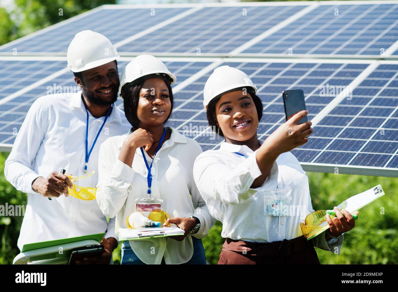 African american technician checks the maintenance of the solar panels ...