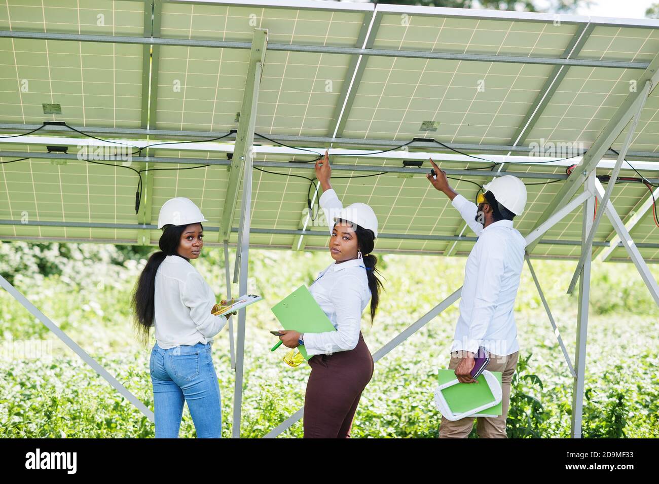 African american technician checks the maintenance of the solar panels ...