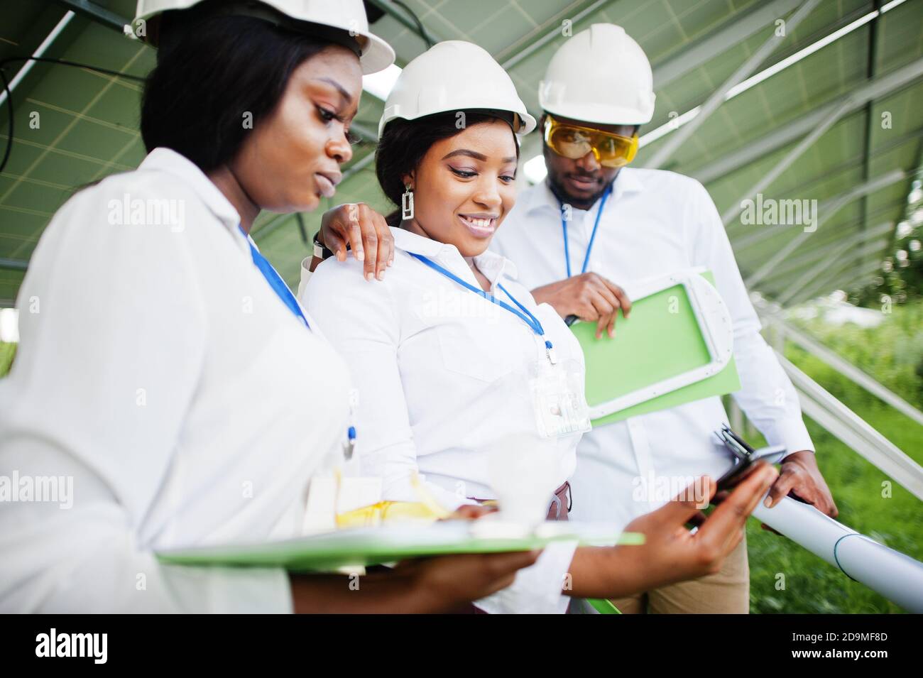African american technician checks the maintenance of the solar panels ...
