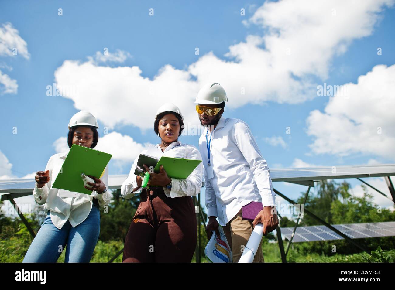 African american technician checks the maintenance of the solar panels ...