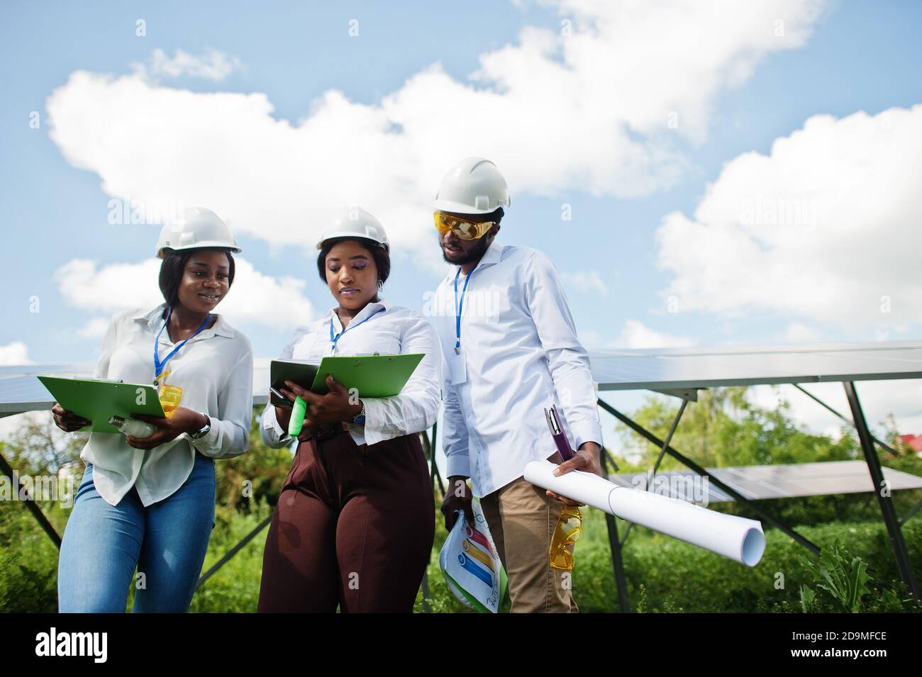 African american technician checks the maintenance of the solar panels ...
