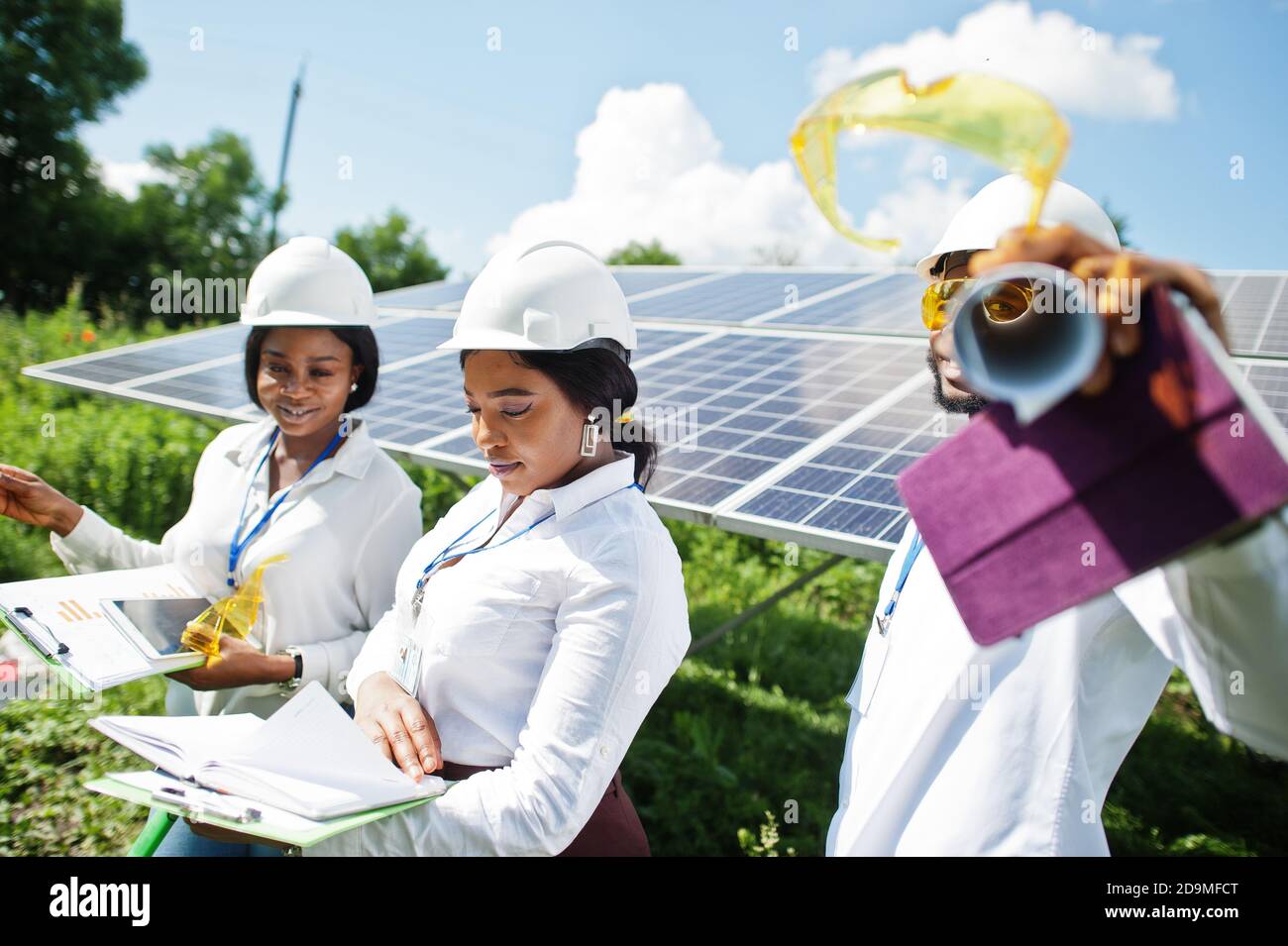 African american technician checks the maintenance of the solar panels ...