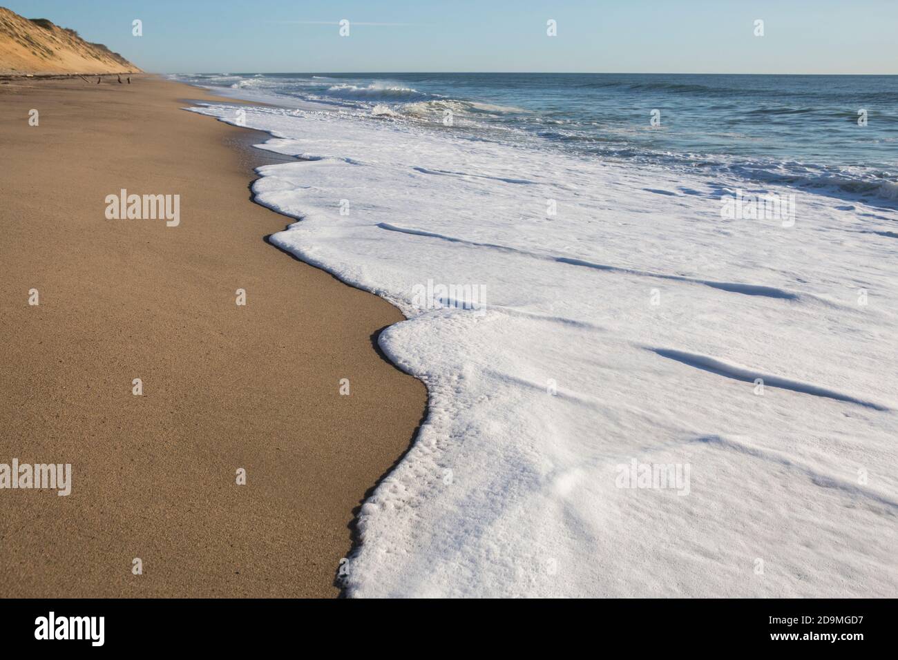 Close-up of seafoam waves lapping the beach sand at Whitecrest Beach ...