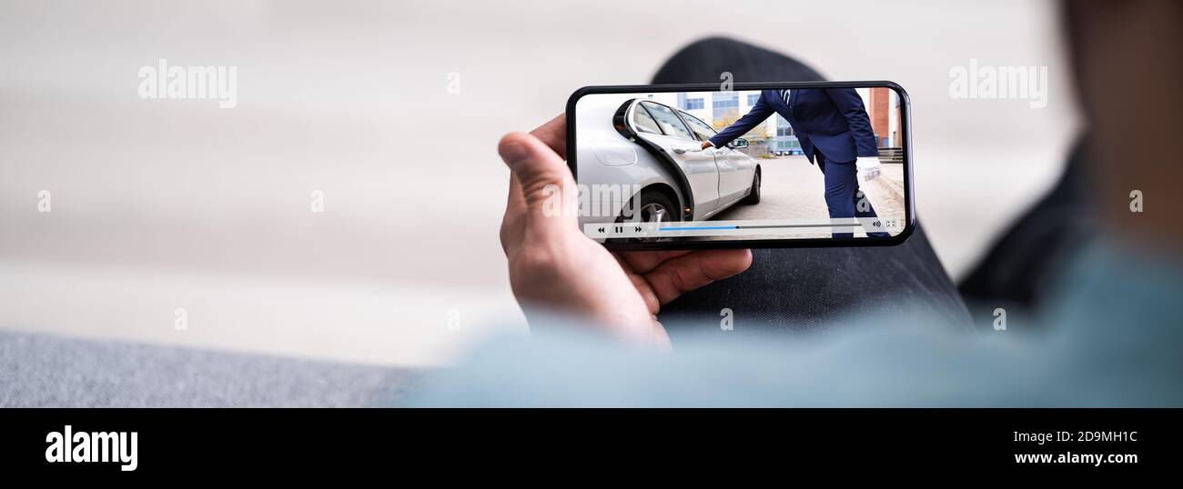 Man Watching Video On Mobile Phone At Home Stock Photo - Alamy