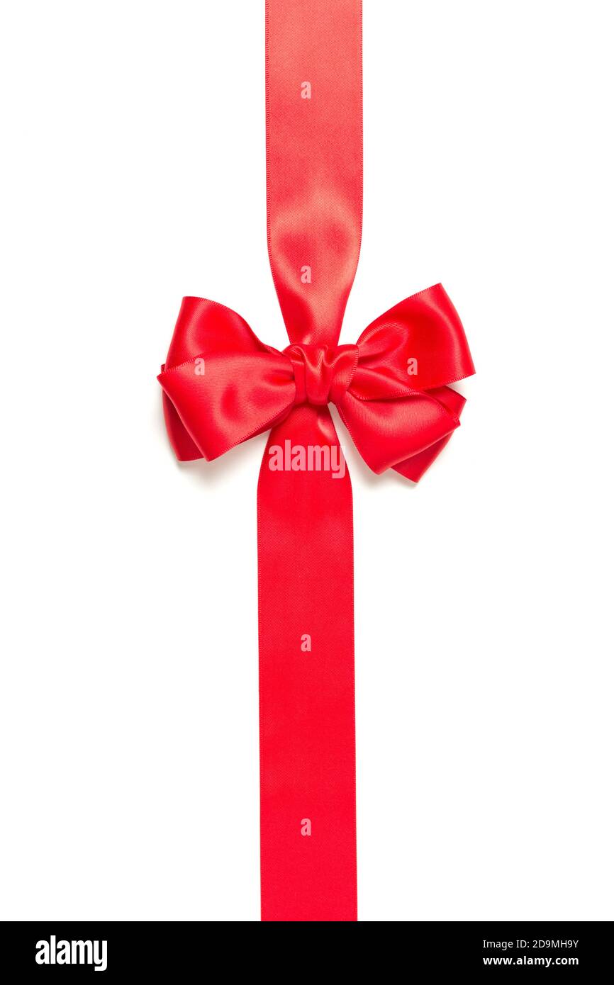 Red gift bow and vertically crossed red ribbon isolated on white ...