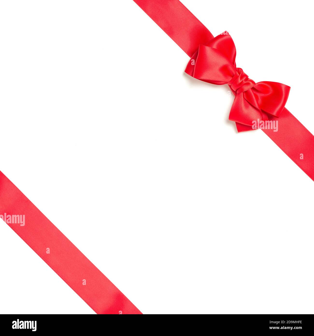Red gift bow and crossed diagonally red ribbon isolated on white ...