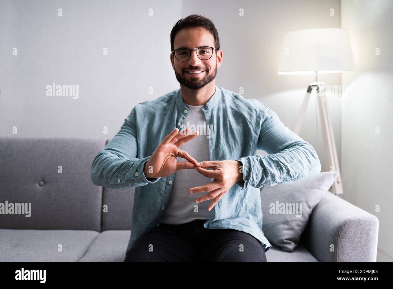 Adult Learning Sign Language For Deaf Disabled Stock Photo - Alamy