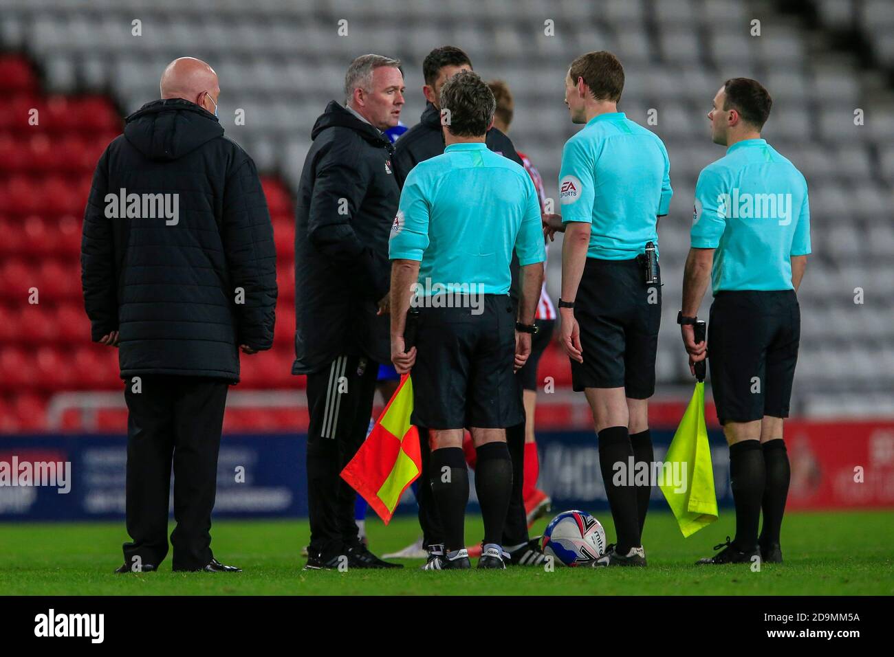 Paul Lambert, manager of Ipswich Town, talks with referee Peter Wright ...
