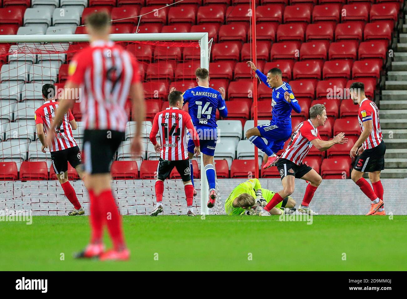 Lee Burge (1) of Sunderland clutches the ball as Kayden Jackson (9) of ...