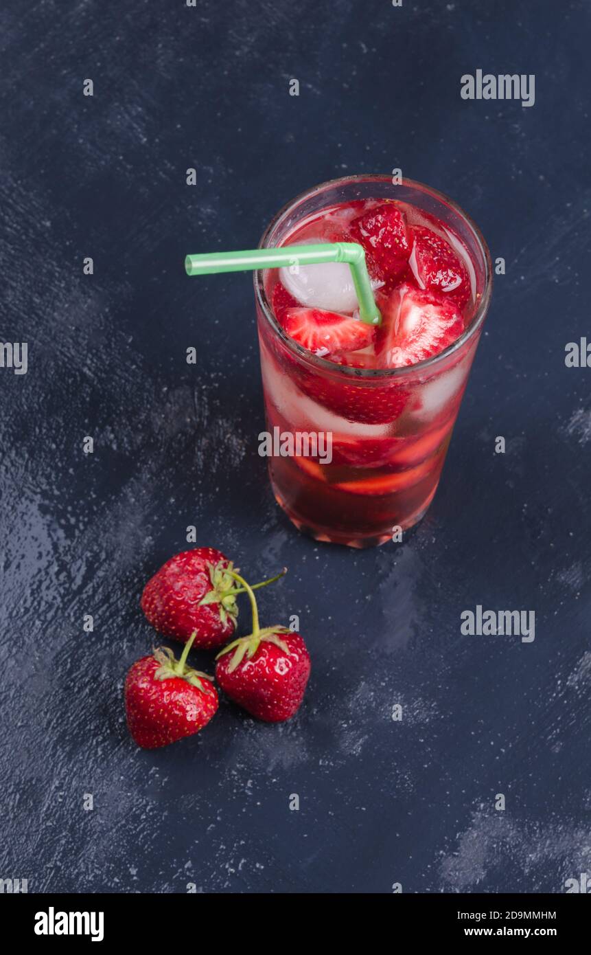 Fresh strawberry alcohol cocktail on dark table Stock Photo - Alamy