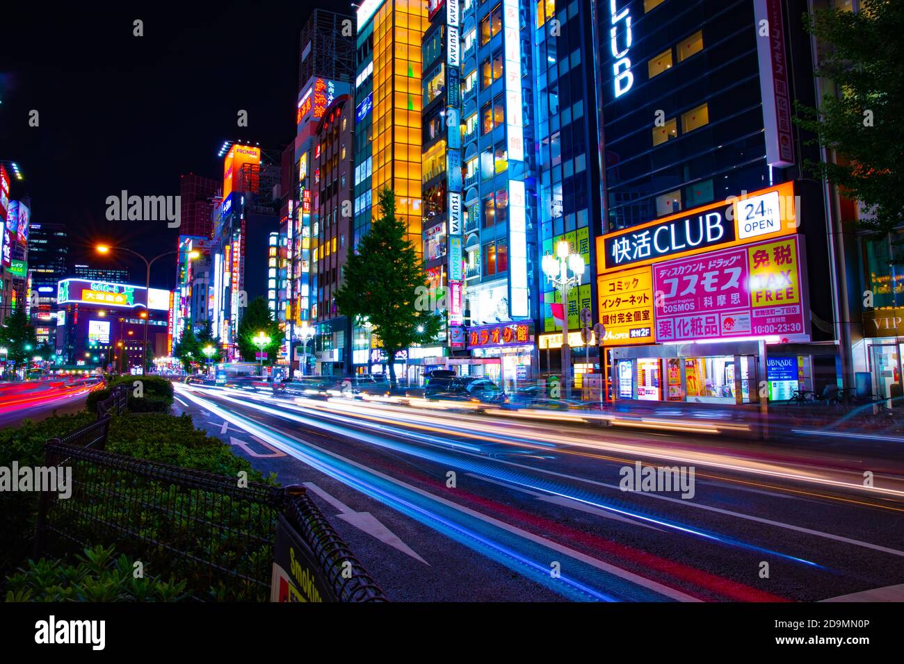 A night neon street in Shinjuku wide shot Stock Photo - Alamy