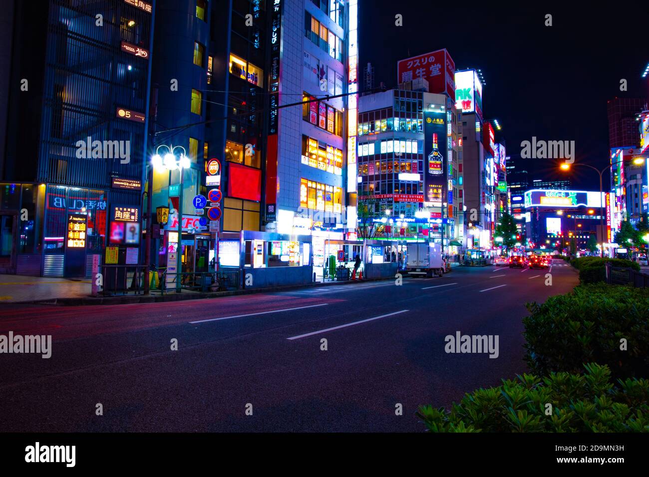 A night neon street in Shinjuku wide shot Stock Photo - Alamy