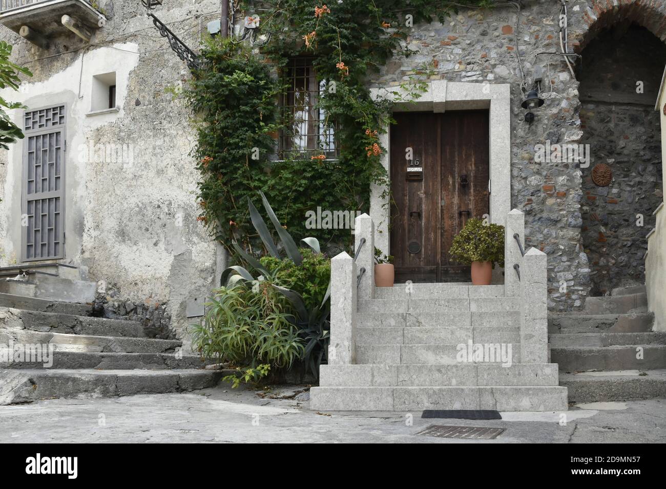 A narrow street among the old houses of Scalea, a rural village in the ...