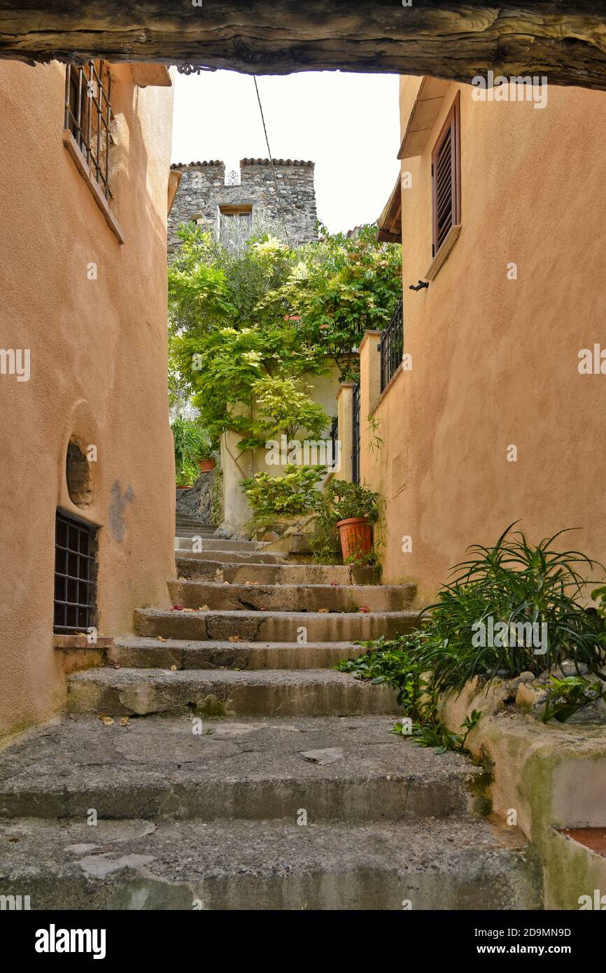 A narrow street among the old houses of Scalea, a rural village in the ...
