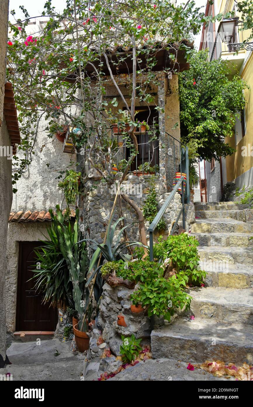 A narrow street among the old houses of Scalea, a rural village in the ...