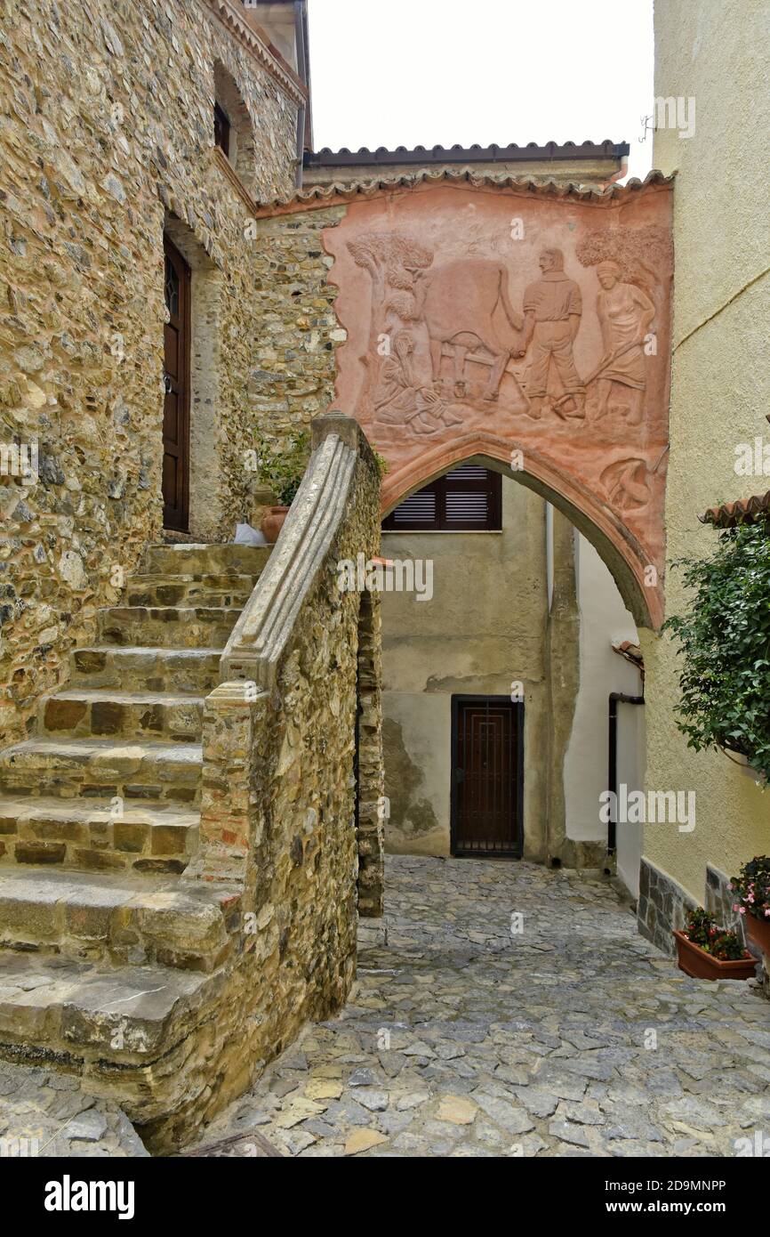 A narrow street among the old houses of Scalea, a rural village in the ...