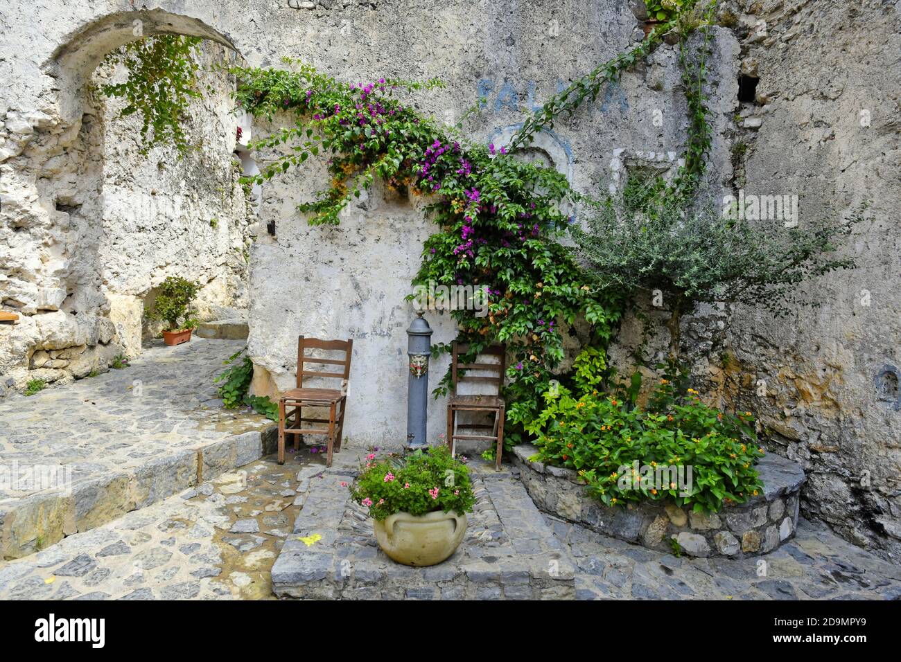 A narrow street among the old houses of Scalea, a rural village in the ...