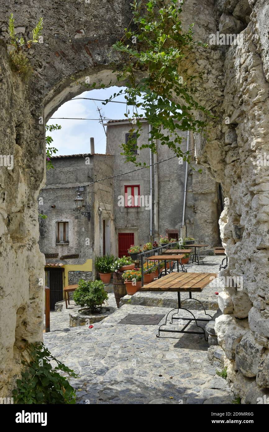 A narrow street among the old houses of Scalea, a rural village in the ...