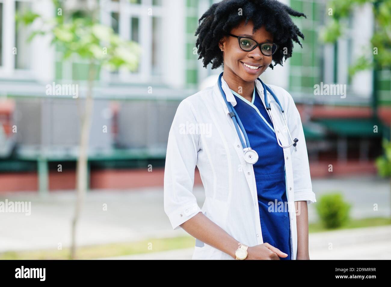 Portrait of African American female doctor with stethoscope wearing lab ...