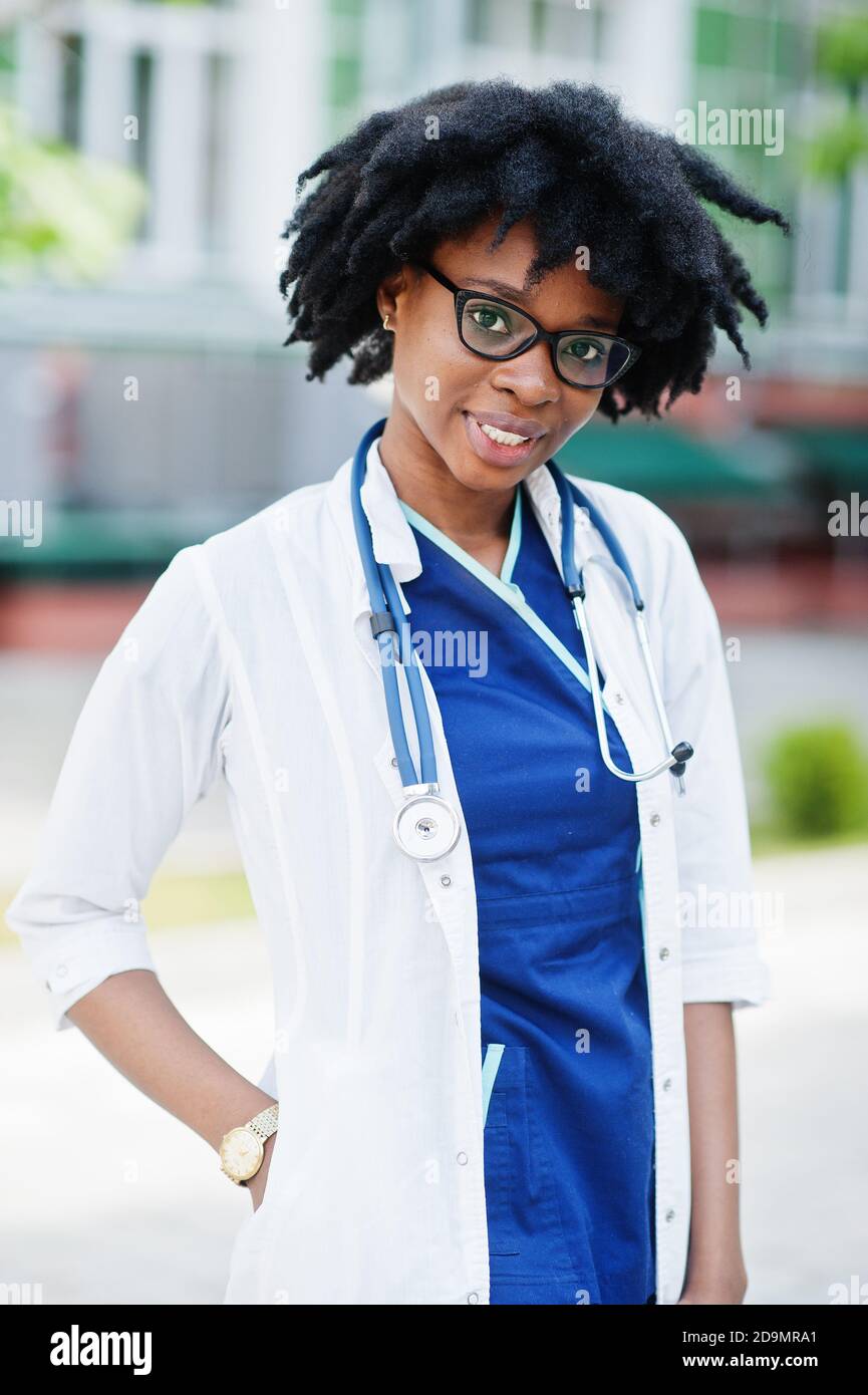 Portrait of African American female doctor with stethoscope wearing lab ...