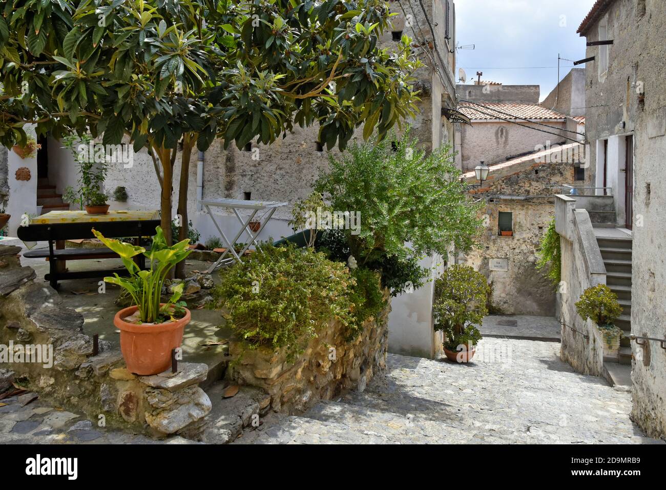 A narrow street among the old houses of Scalea, a rural village in the ...