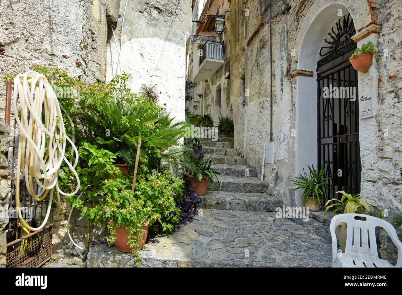 A narrow street among the old houses of Scalea, a rural village in the ...