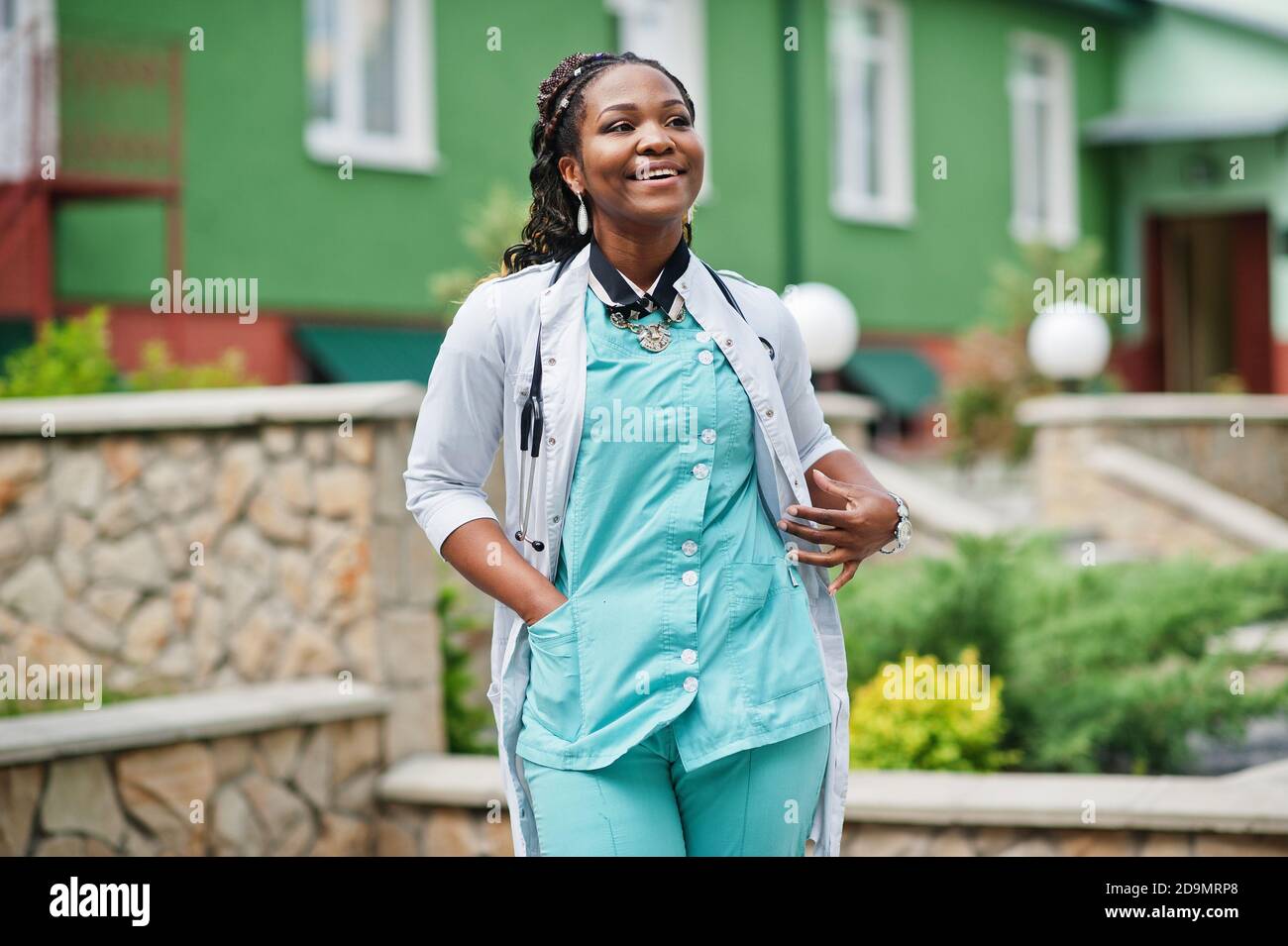 Portrait of African American female doctor with stethoscope wearing lab ...