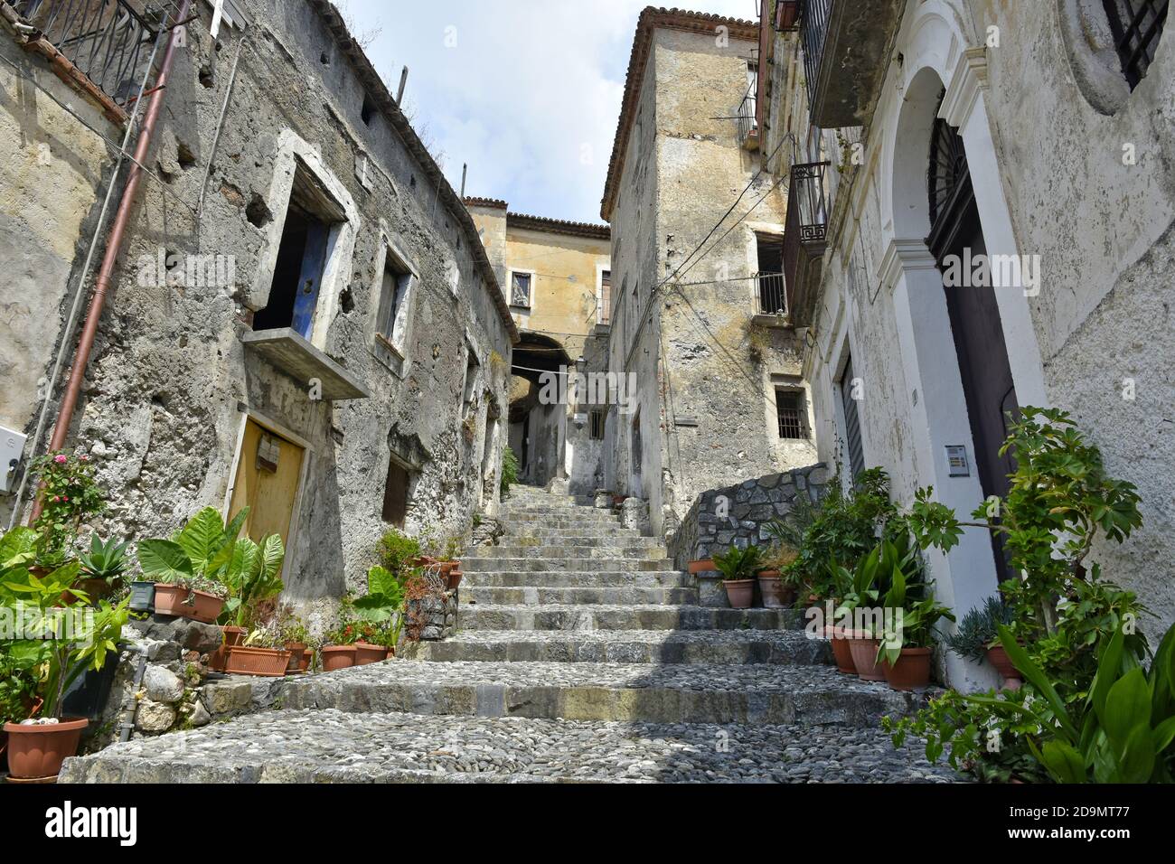 A narrow street among the old houses of Scalea, a rural village in the ...