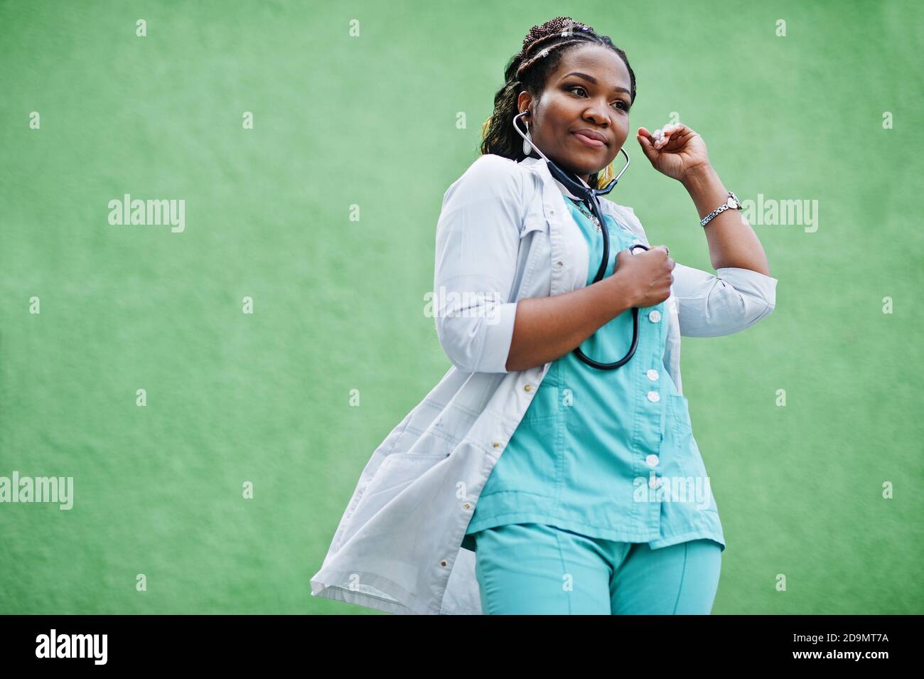 Portrait of African American female doctor with stethoscope wearing lab ...