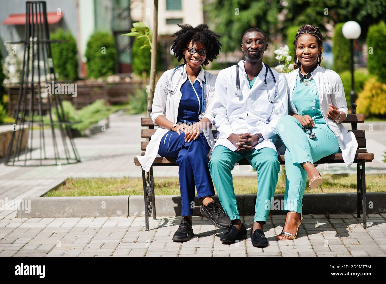 Three African American group doctors with stethoscope wearing lab coat ...